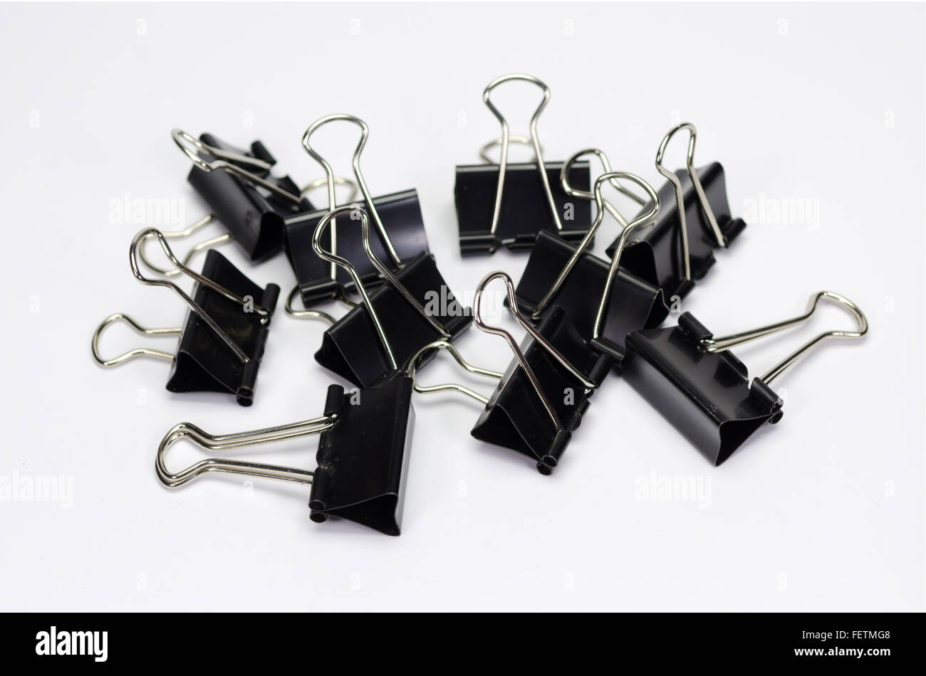Black paper clip isolated on white background Stock Photo - Alamy