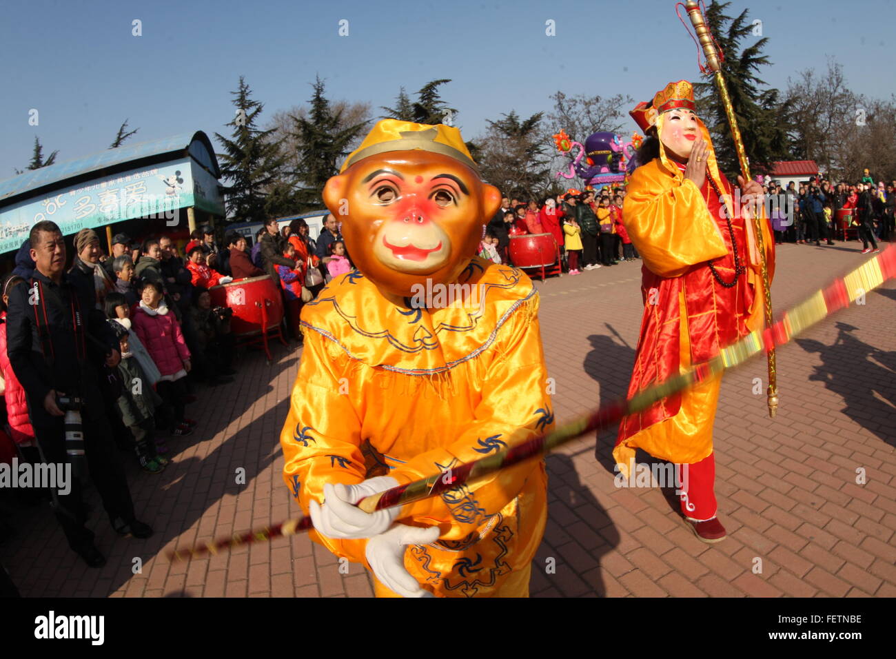 Yantai. 9th Feb, 2016. People view folk art performance during a fair ...