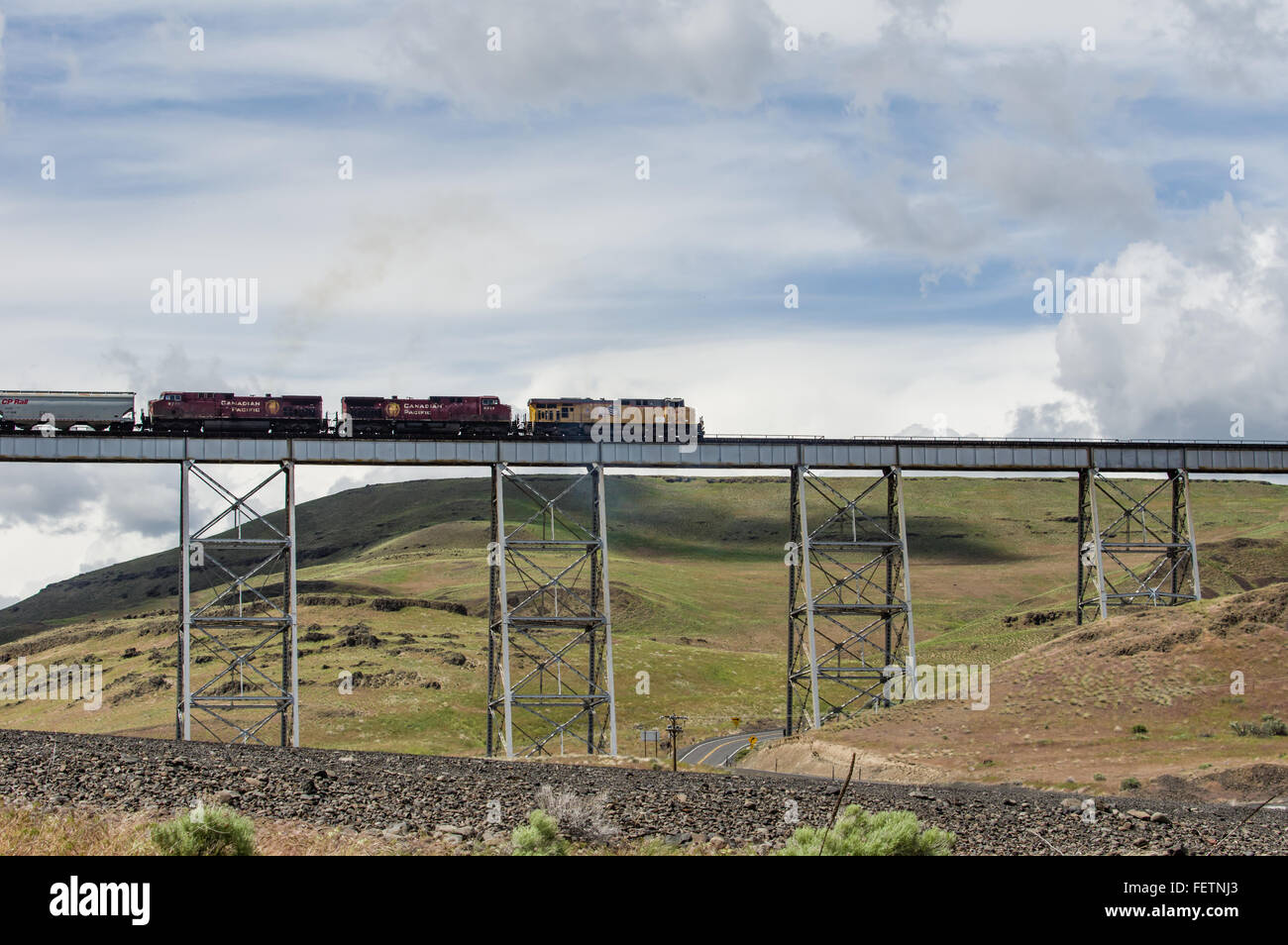 Freight train crossing a tall metal trestle near LaCrosse, Washington ...