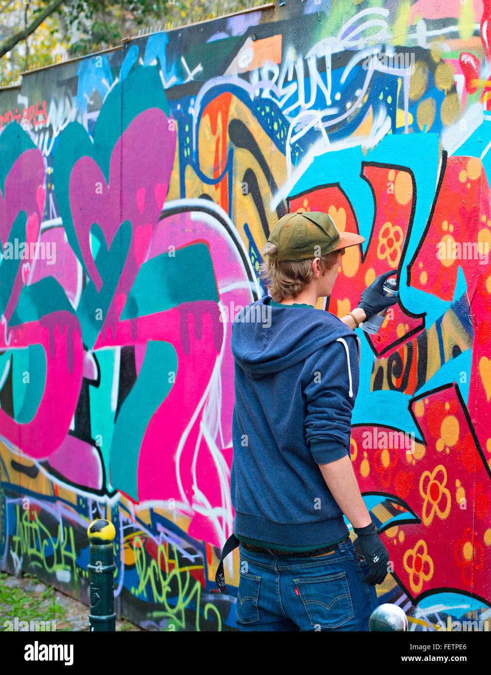 Male teen painting wall spray paint hi-res stock photography and images ...
