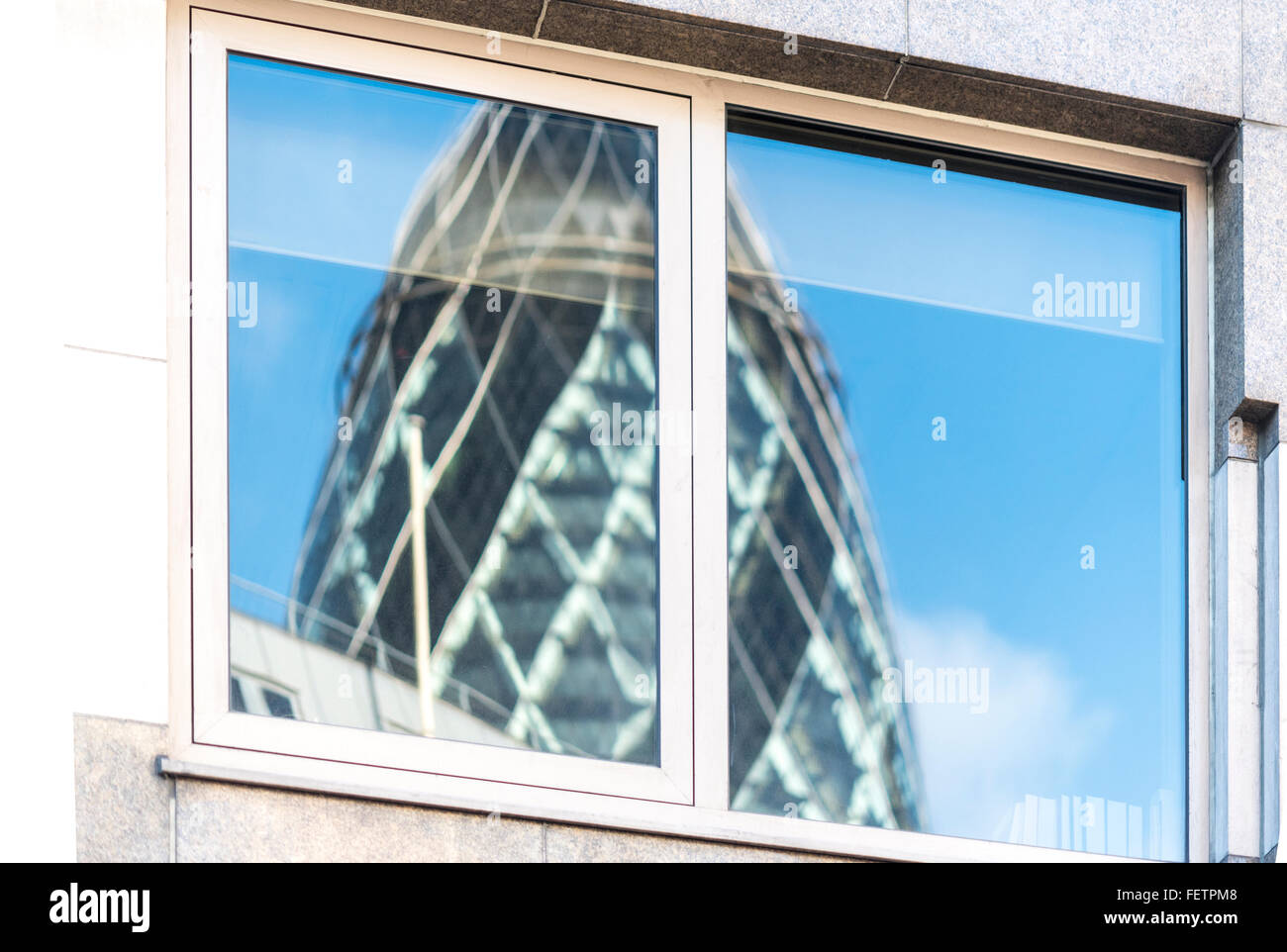 A reflection of the Gherkin in a London window Stock Photo - Alamy