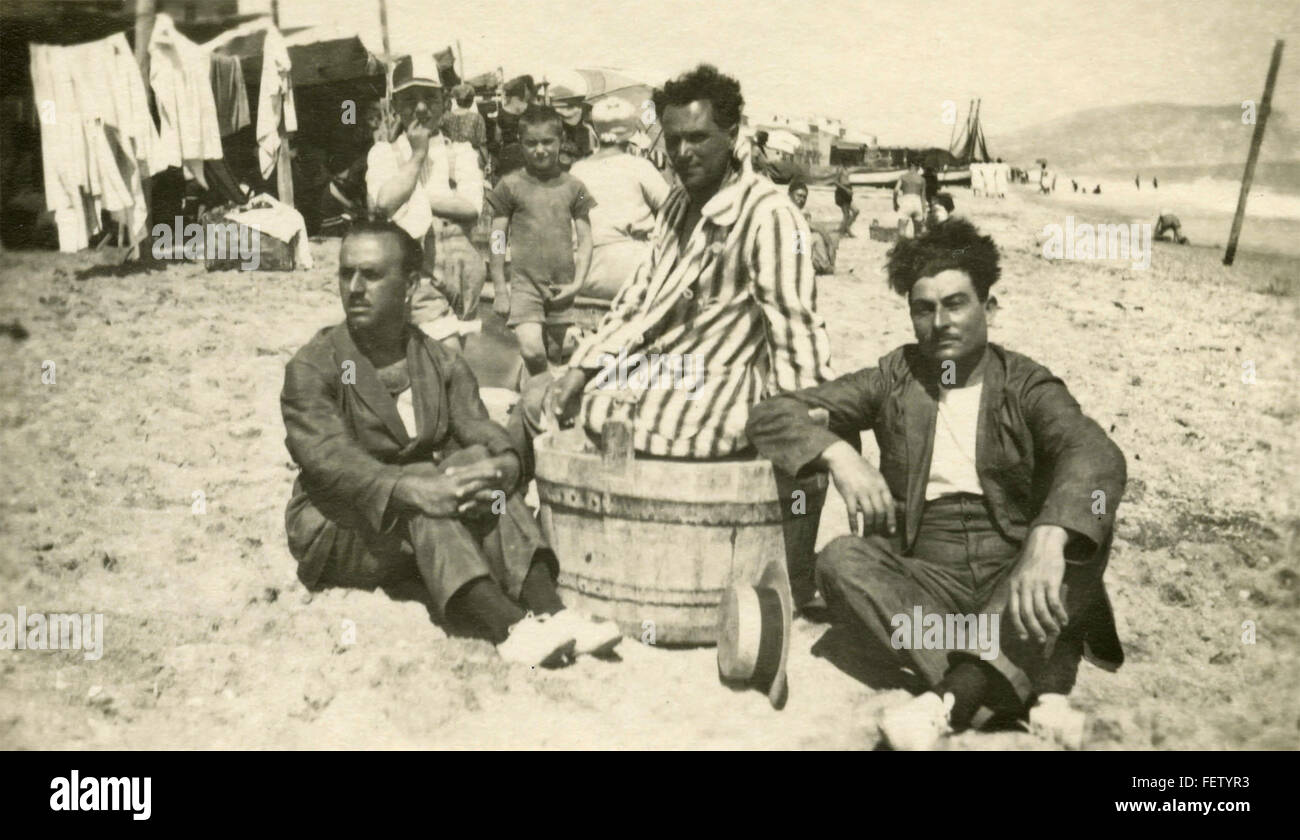 Three men at the beach, Italy Stock Photo - Alamy