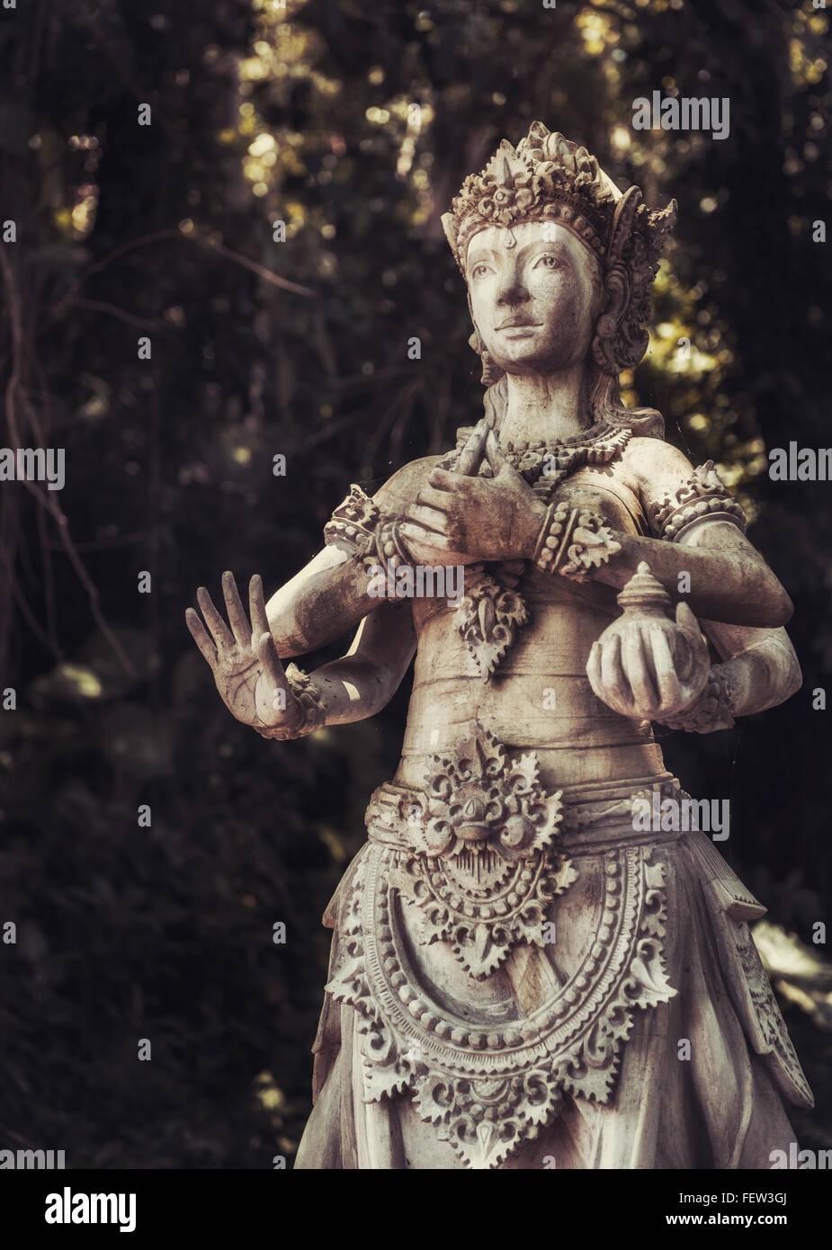 The old stone statue. Indonesia, Bali Stock Photo - Alamy