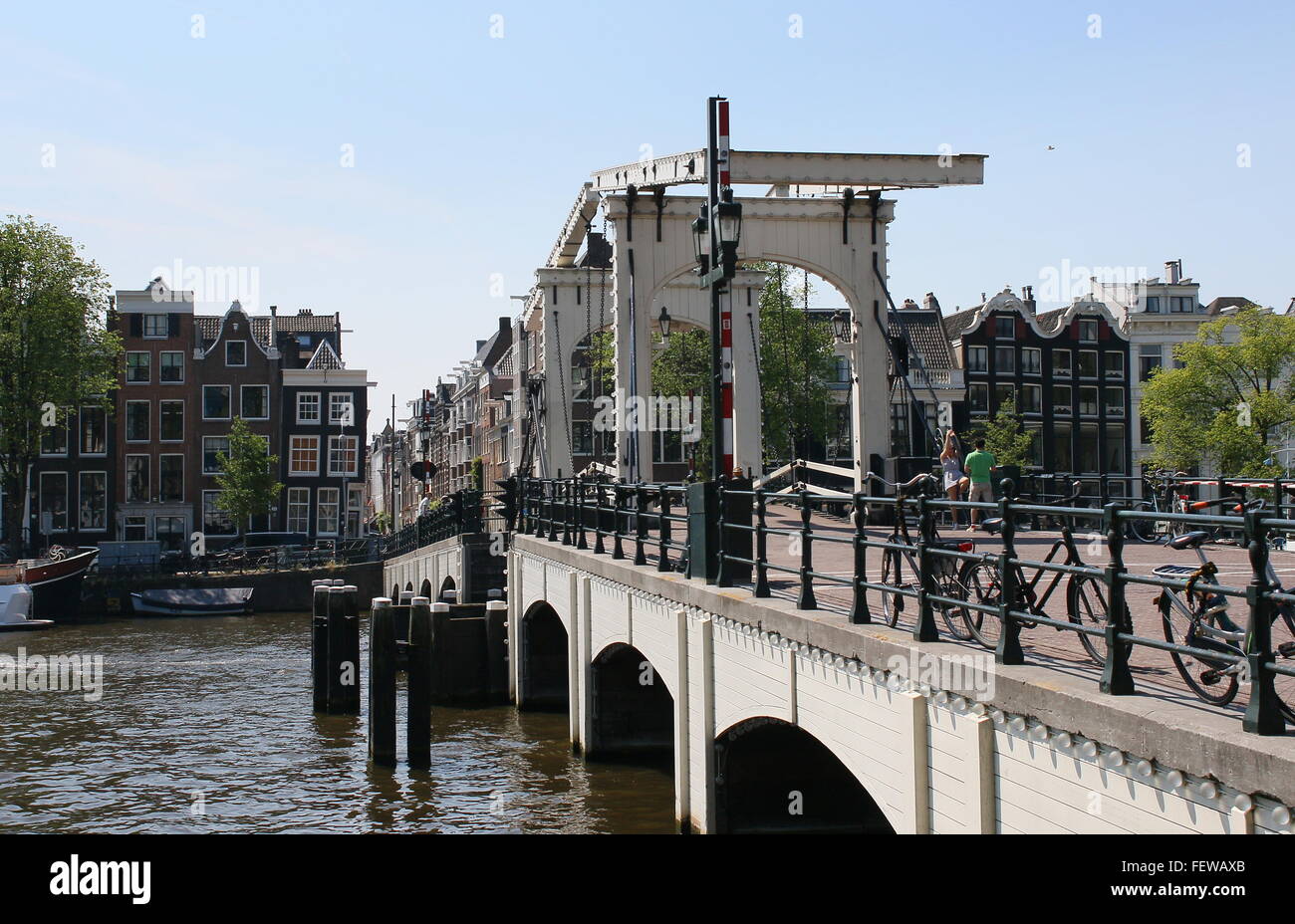 Bikes parked at Magere Brug or 'Skinny Bridge' across Amstel river in ...