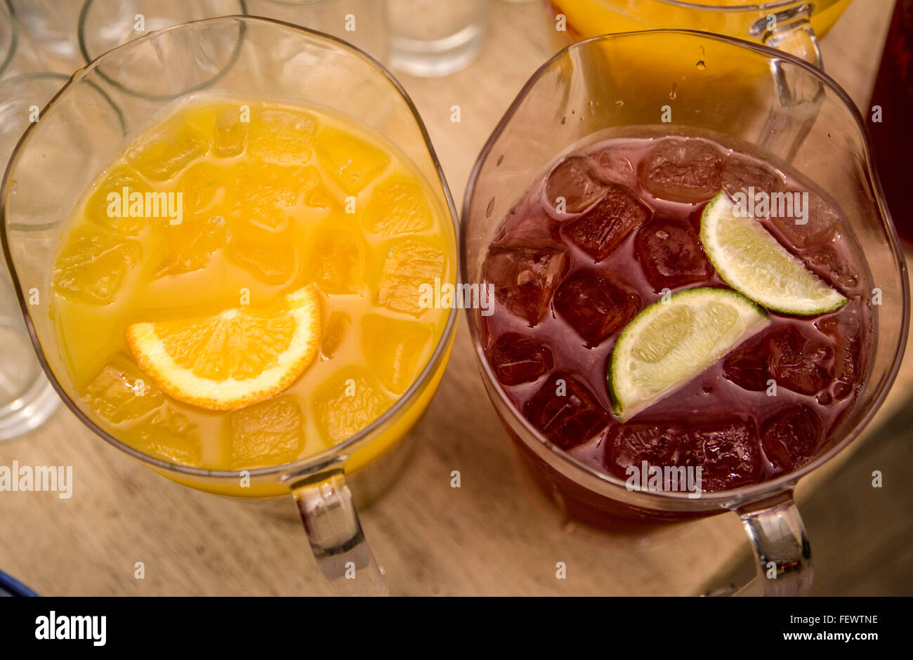 Jugs of iced orange and cranberry cordial Stock Photo - Alamy