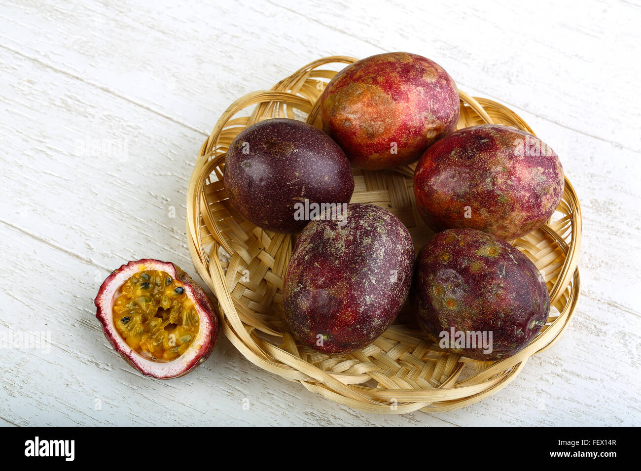 Tropical Passion fruit on the wood background Stock Photo - Alamy