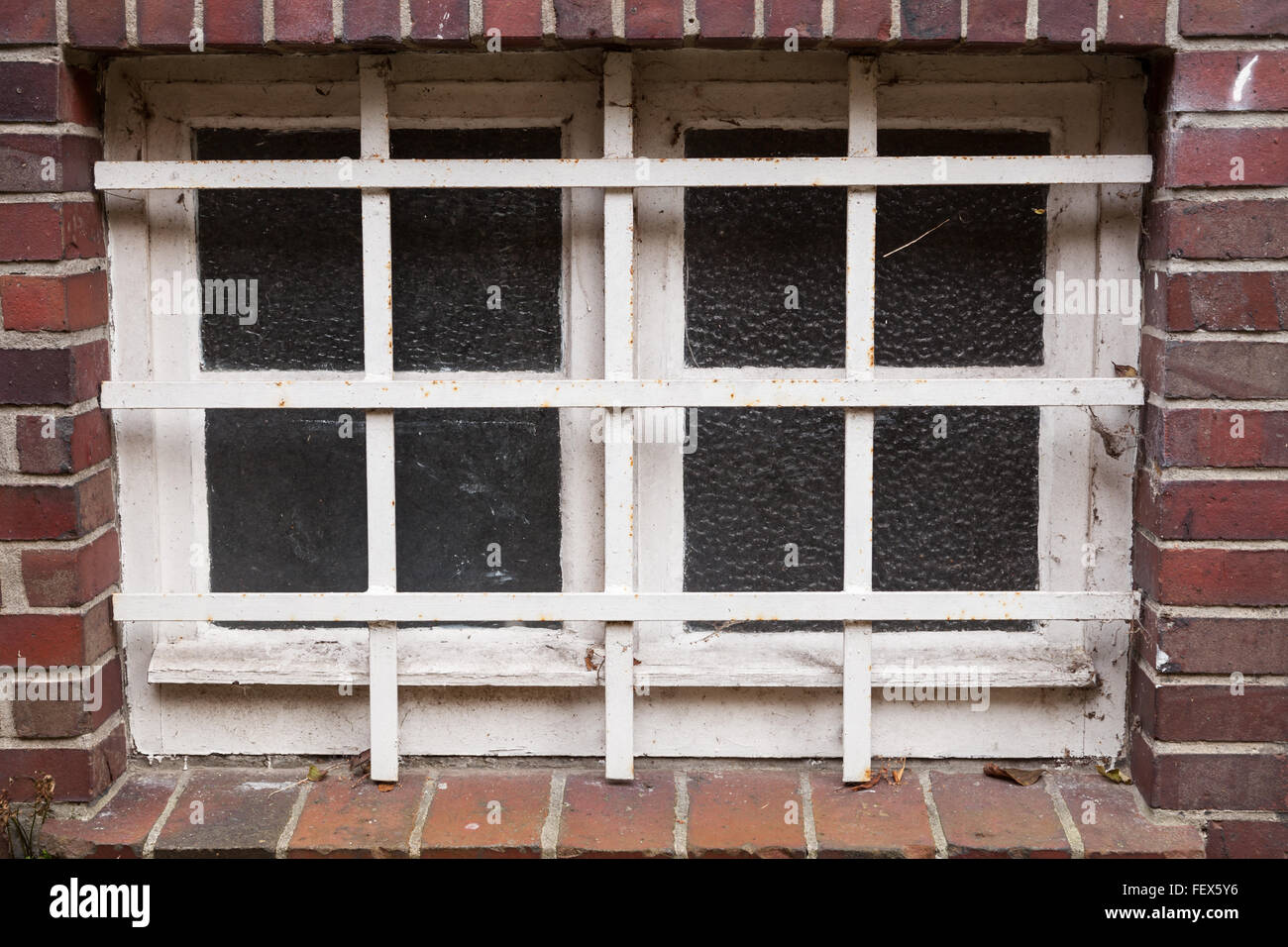 Barred cellar window in hi-res stock photography and images - Alamy