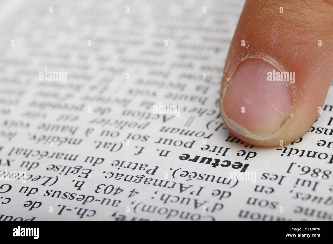 Child reading dictionnary on word reading Stock Photo - Alamy