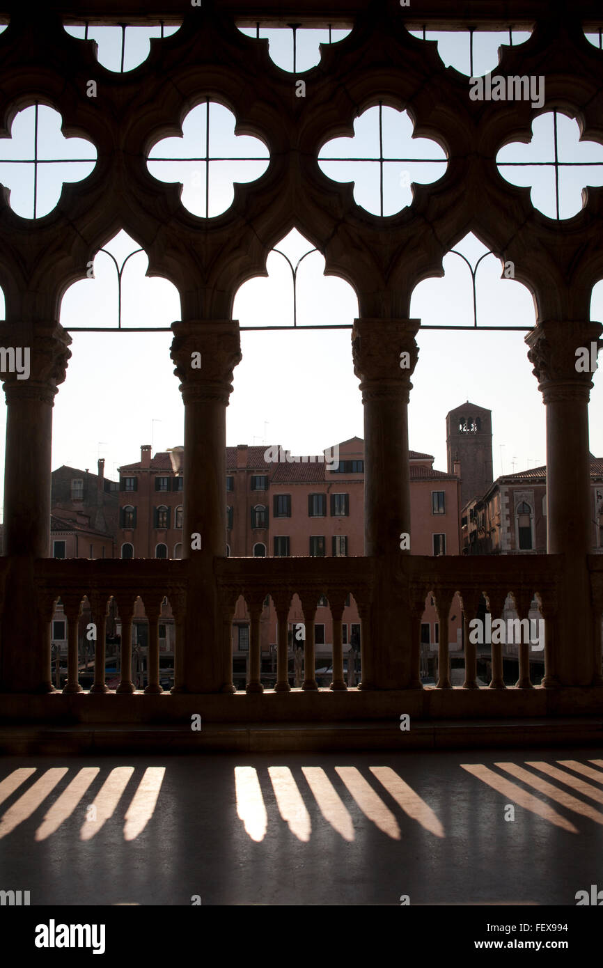 Balcony columns and arches with shadows overlooking the Grand Canal Ca ...