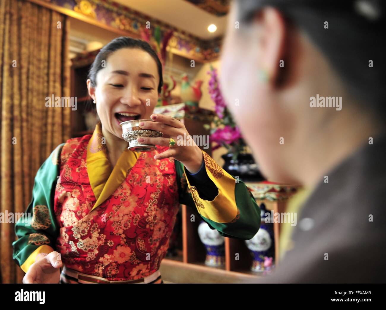 Lhasa, China's Tibet Autonomous Region. 9th Feb, 2016. A citizen tastes ...
