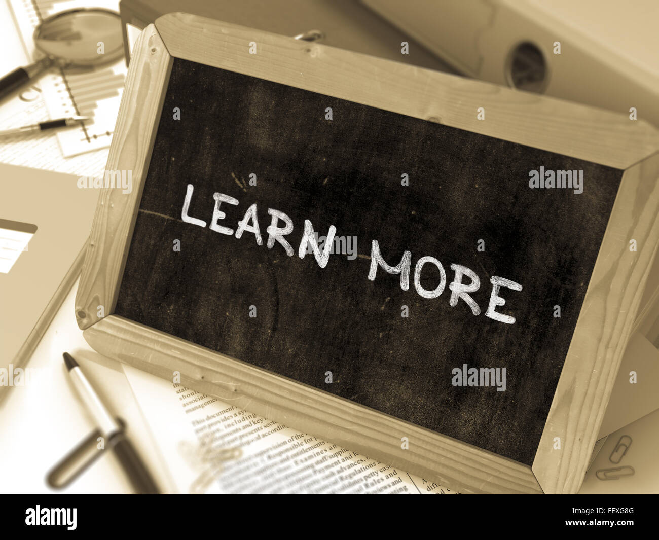 Learn More Handwritten on Chalkboard Stock Photo - Alamy