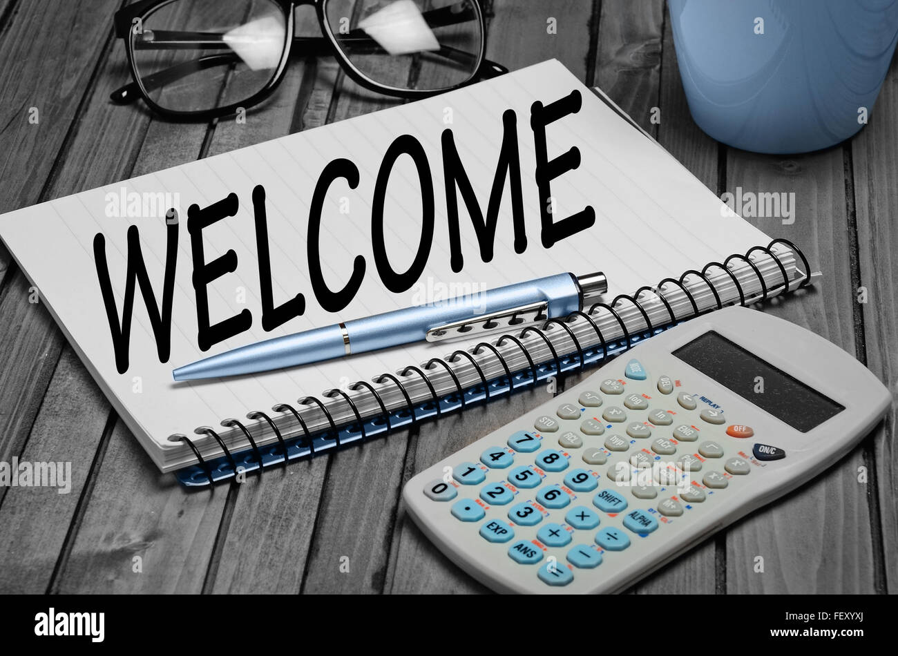 Welcome word written on notepad Stock Photo - Alamy
