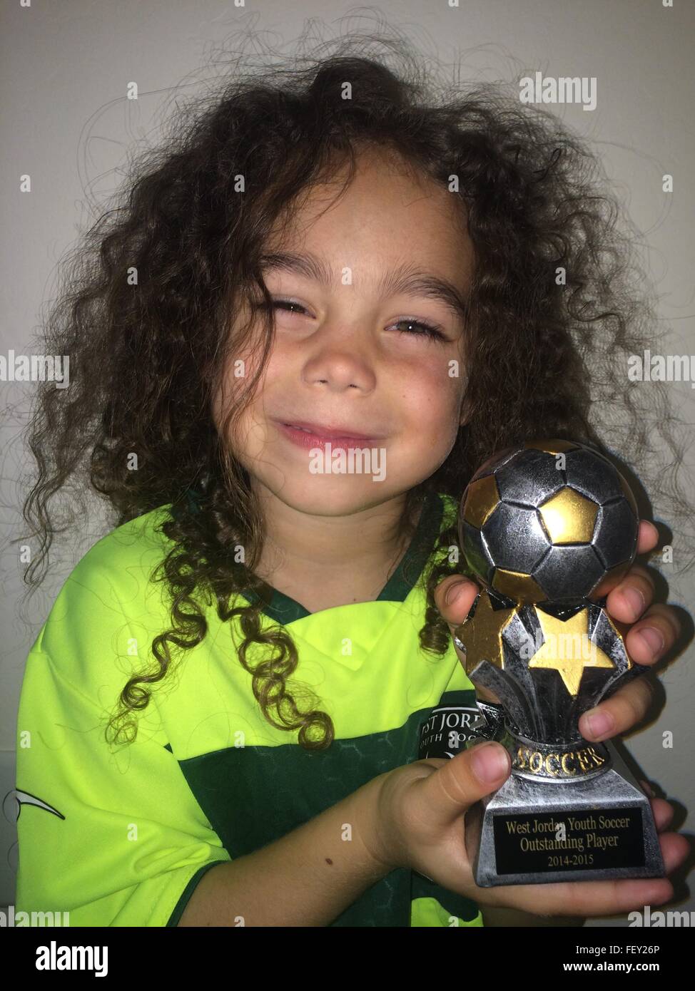 Girl holding trophy hi-res stock photography and images - Alamy