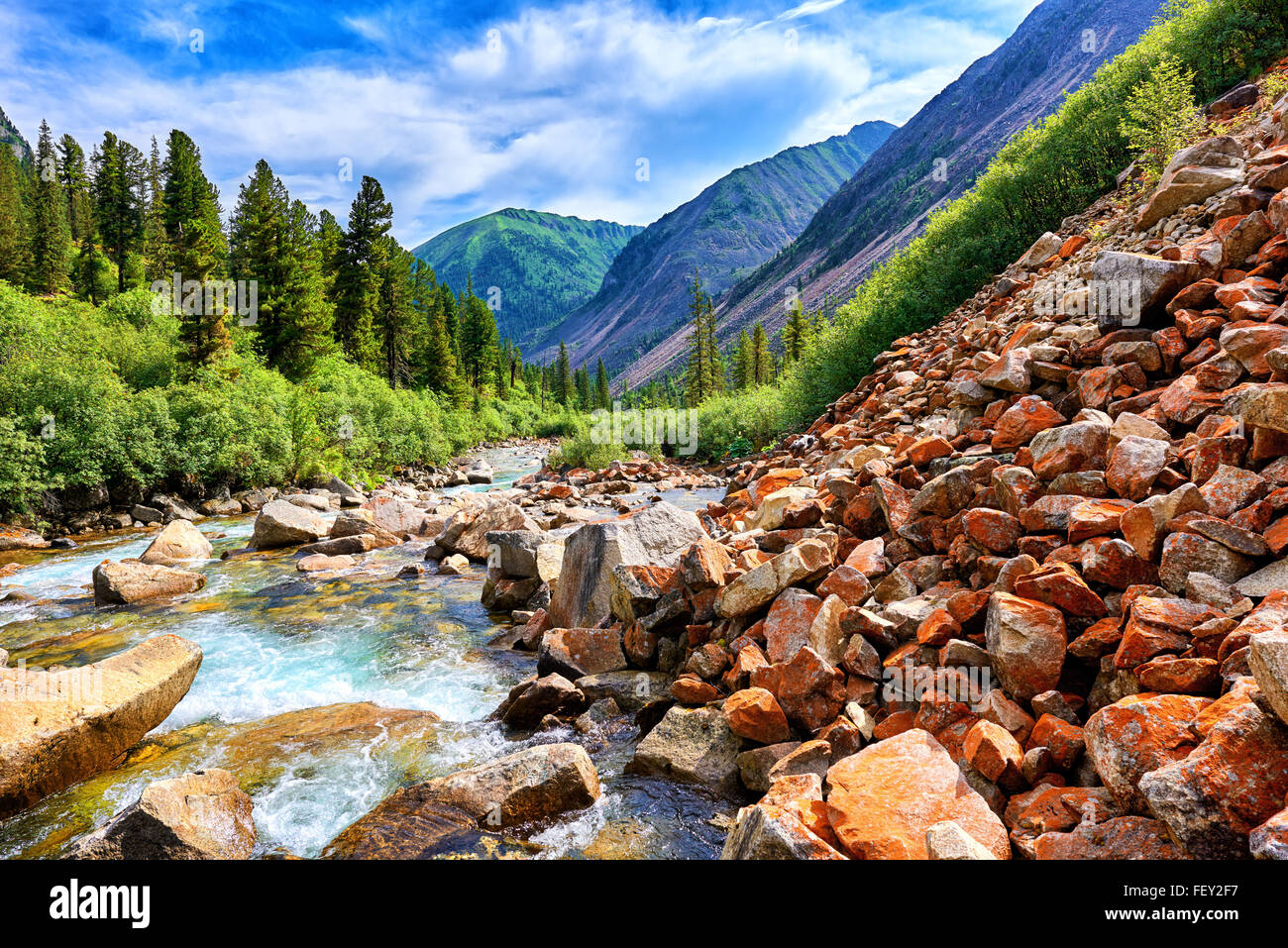 Scree slope from large fragments covered in red lichen mountain river ...
