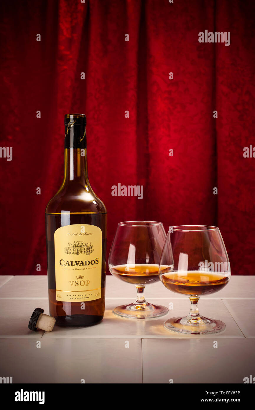 A bottle of Calvados apple brandy from Normandy, France, with two ...