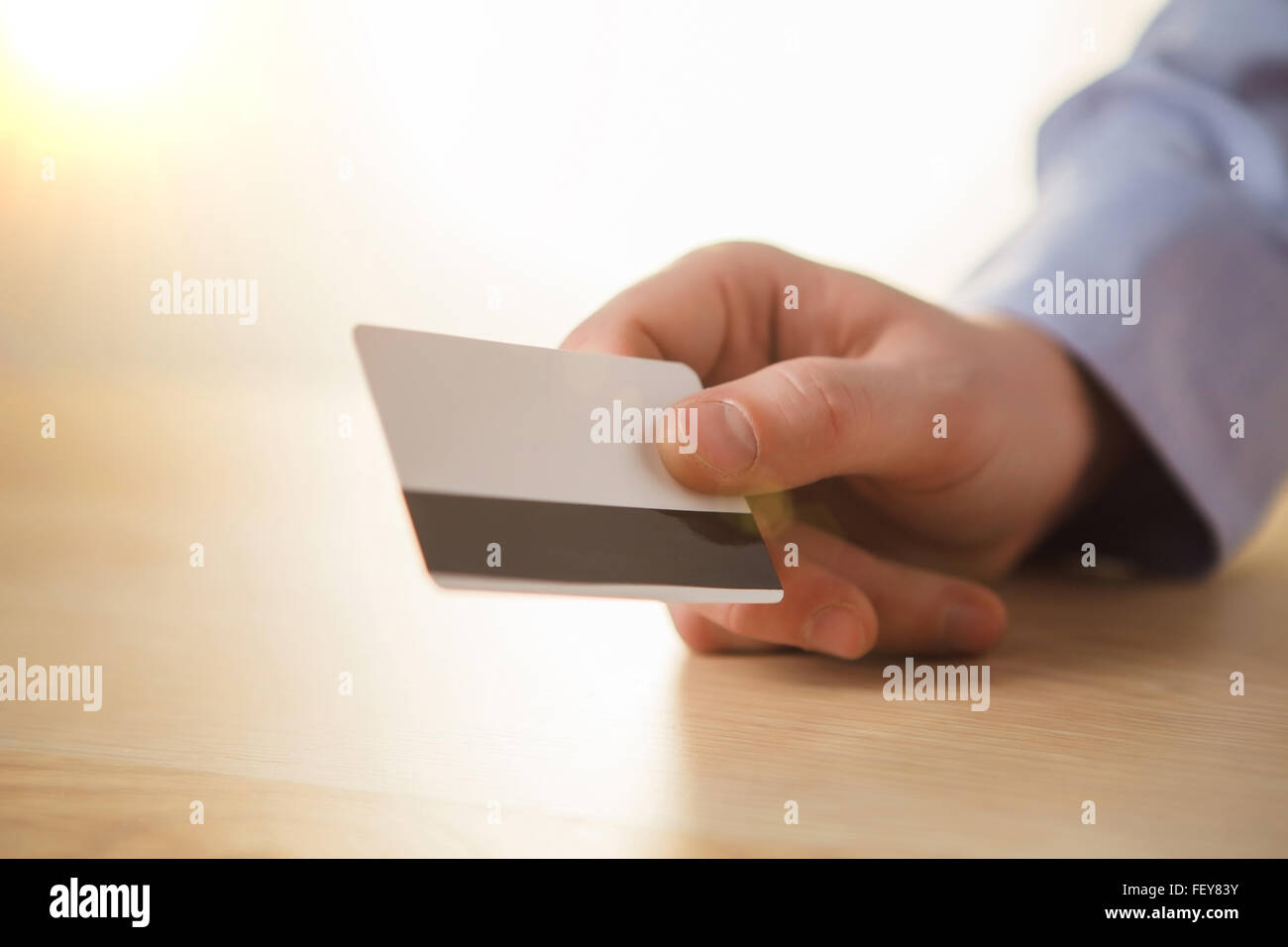 The male hand showing credit card Stock Photo - Alamy