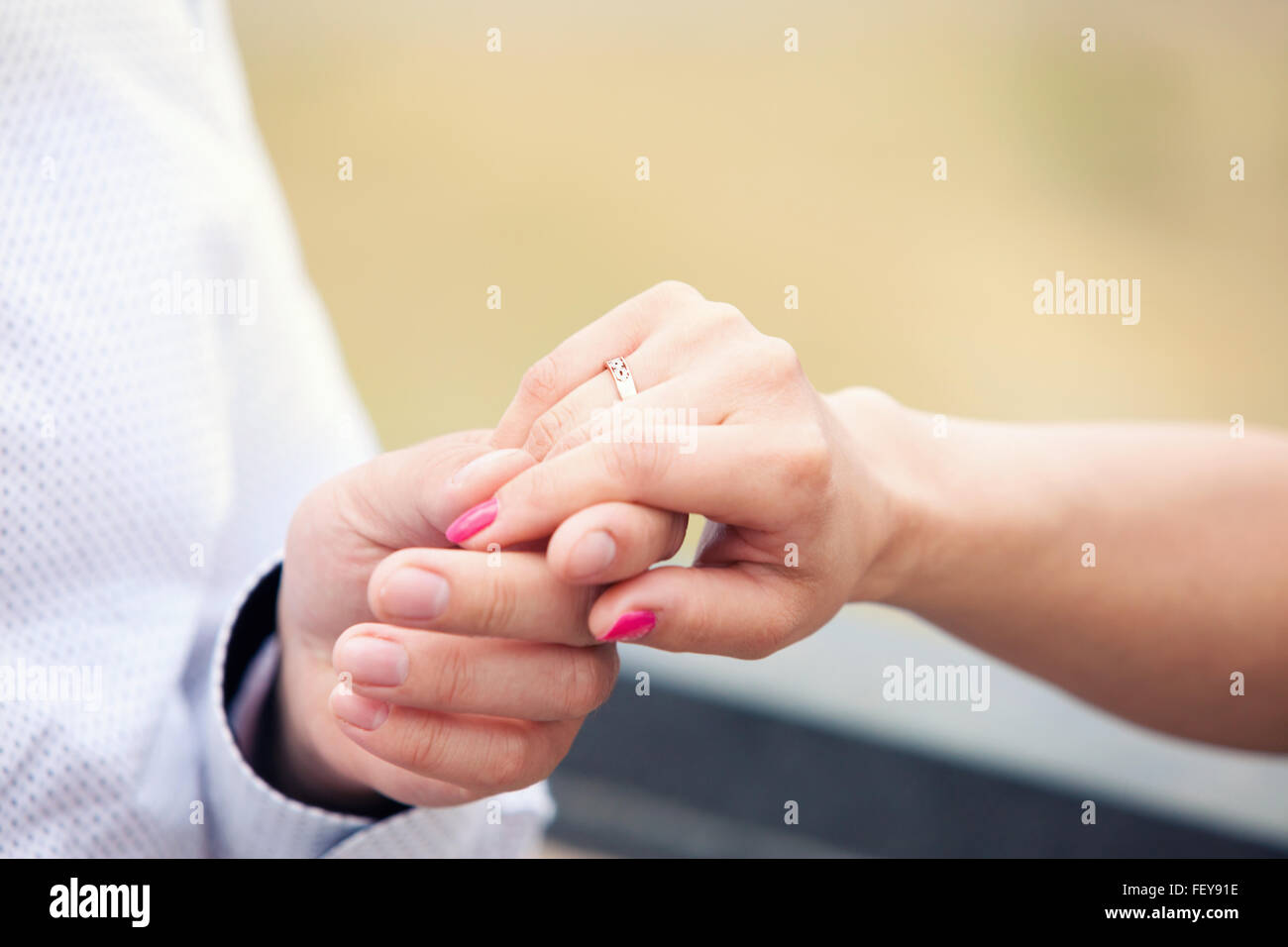 lovers hold each other by hands Stock Photo - Alamy