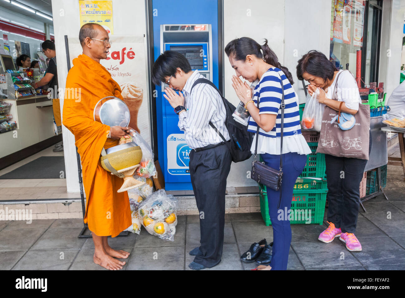 Thailand, Bangkok, People Giving Offerings to Monk Stock Photo - Alamy