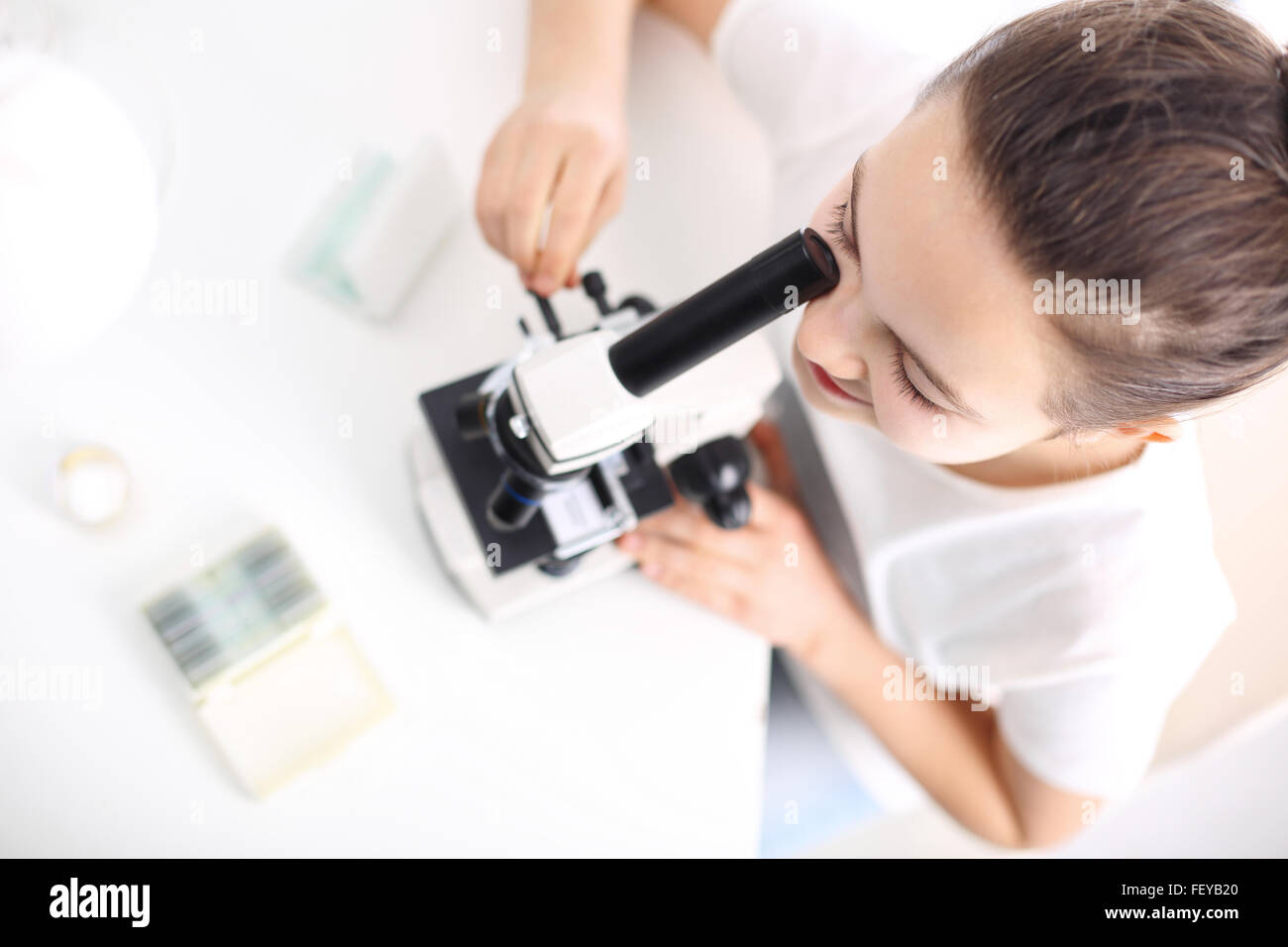 Ecology, nature, wildlife, the girl with a microscope. preparation ...