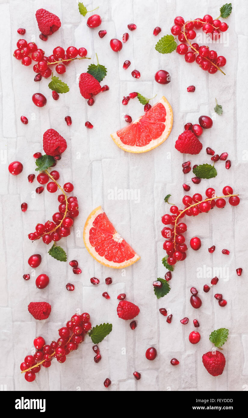 Fresh whole and sliced red fruits. Collection of fresh whole and sliced ...