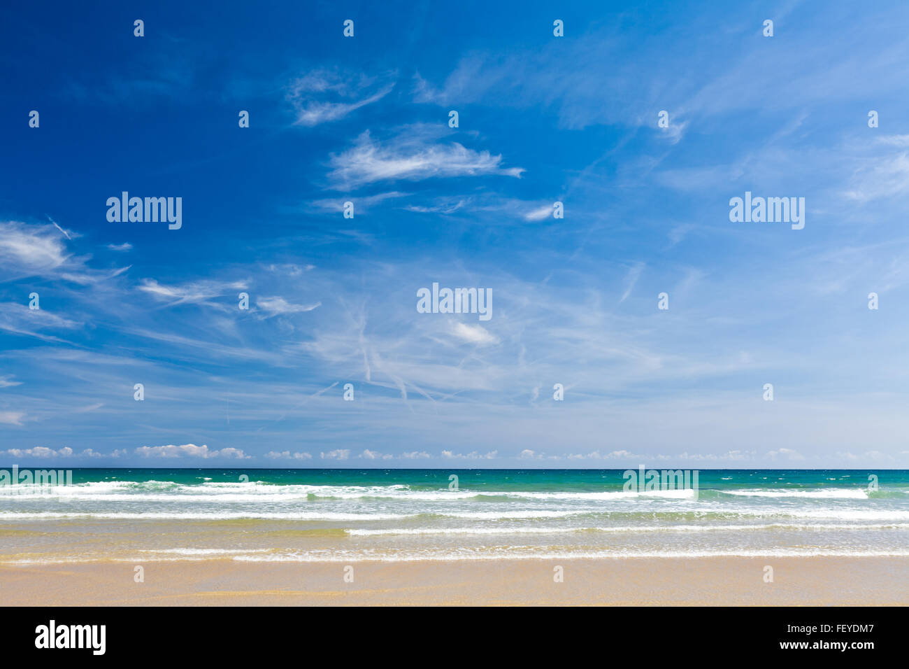 Sand beach, calm sea and blue sky, lots of copy space Stock Photo - Alamy