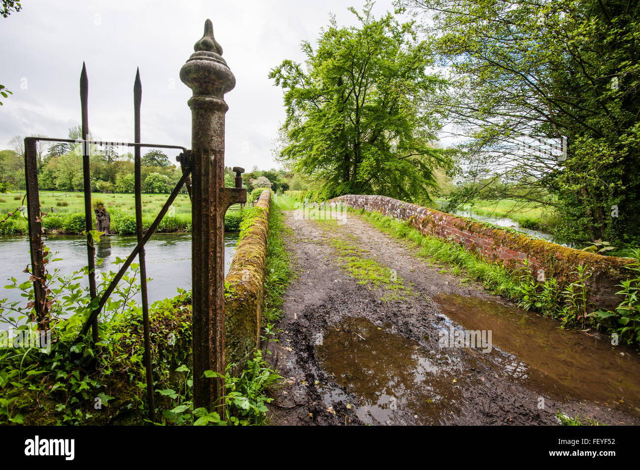 Wet Footbridge Over River Stock Photo - Alamy