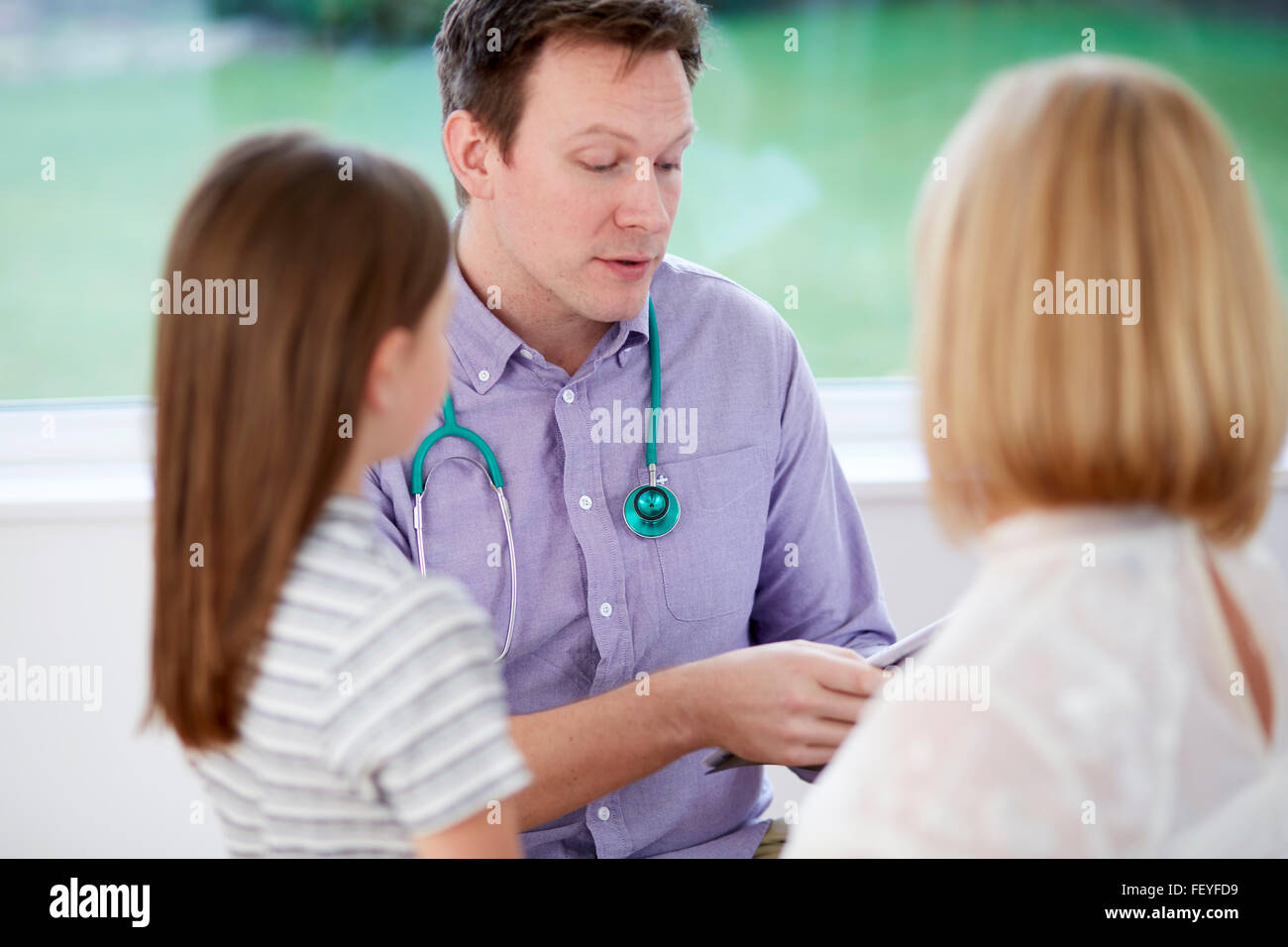 Doctor talking to patient Stock Photo - Alamy