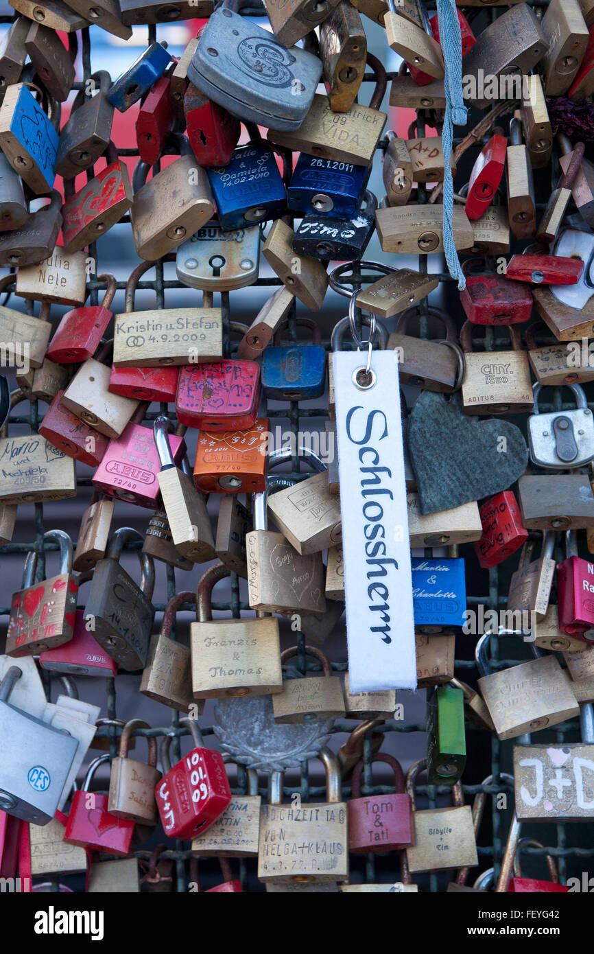 Europe, Germany, Cologne, padlocks on fence of footpath of the ...
