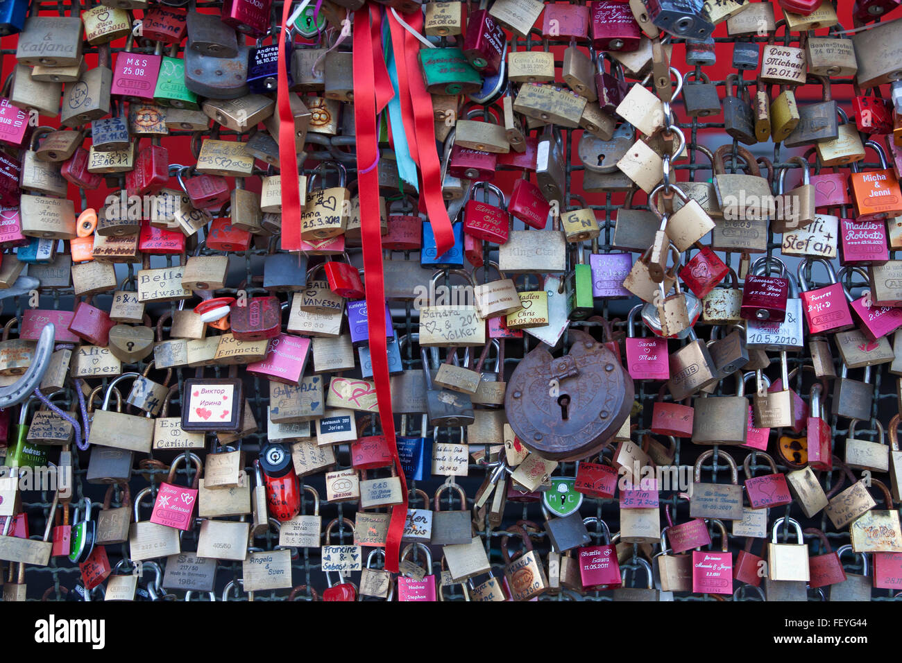 Europe, Germany, Cologne, padlocks on fence of footpath of the ...
