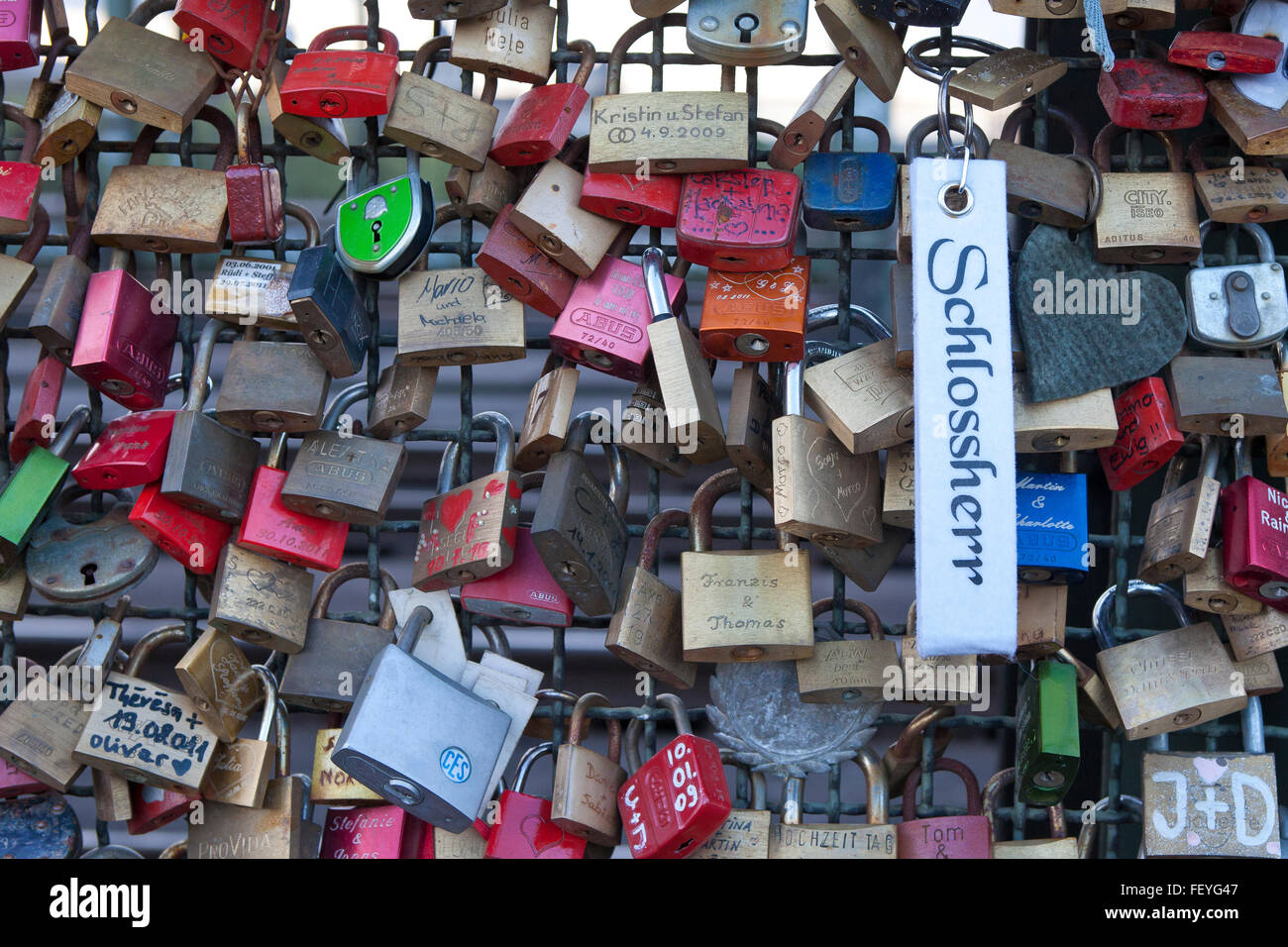 Europe, Germany, Cologne, padlocks on fence of footpath of the ...
