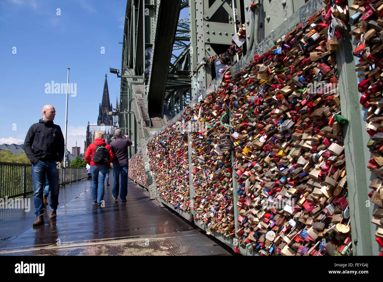Europe, Germany, Cologne, padlocks on fence of footpath of the ...