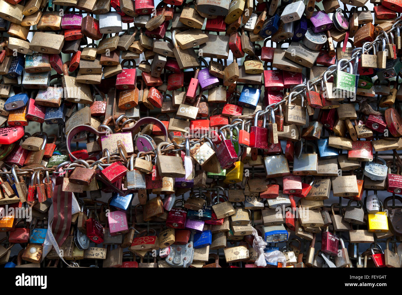 Europe, Germany, Cologne, padlocks on fence of footpath of the ...