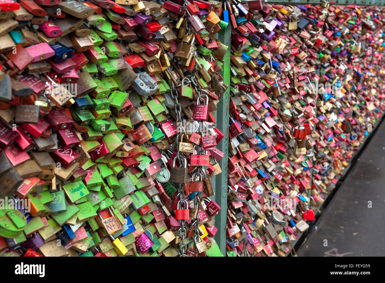 Europe, Germany, Cologne, padlocks on fence of footpath of the ...