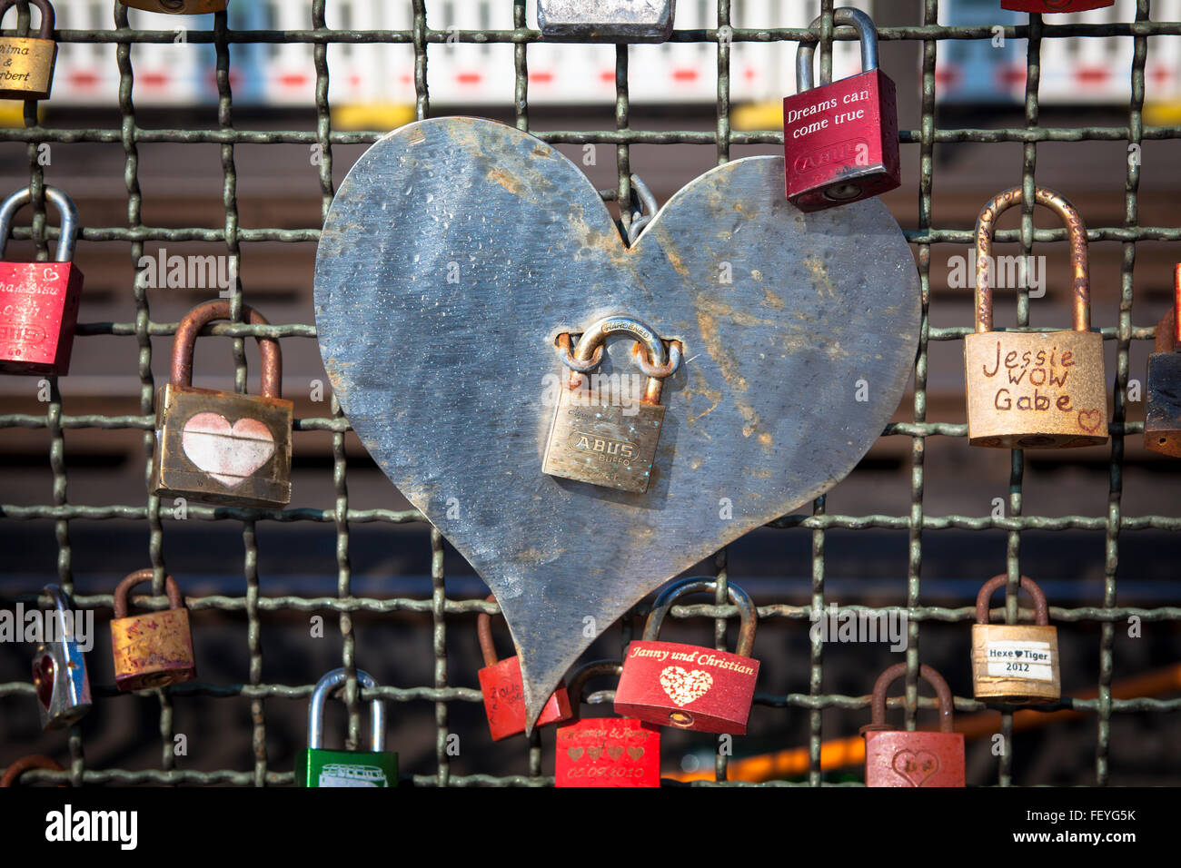 Europe, Germany, Cologne, padlocks on fence of footpath of the ...