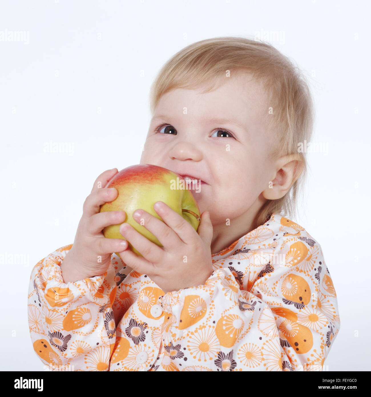 Cute child with red apple Stock Photo - Alamy