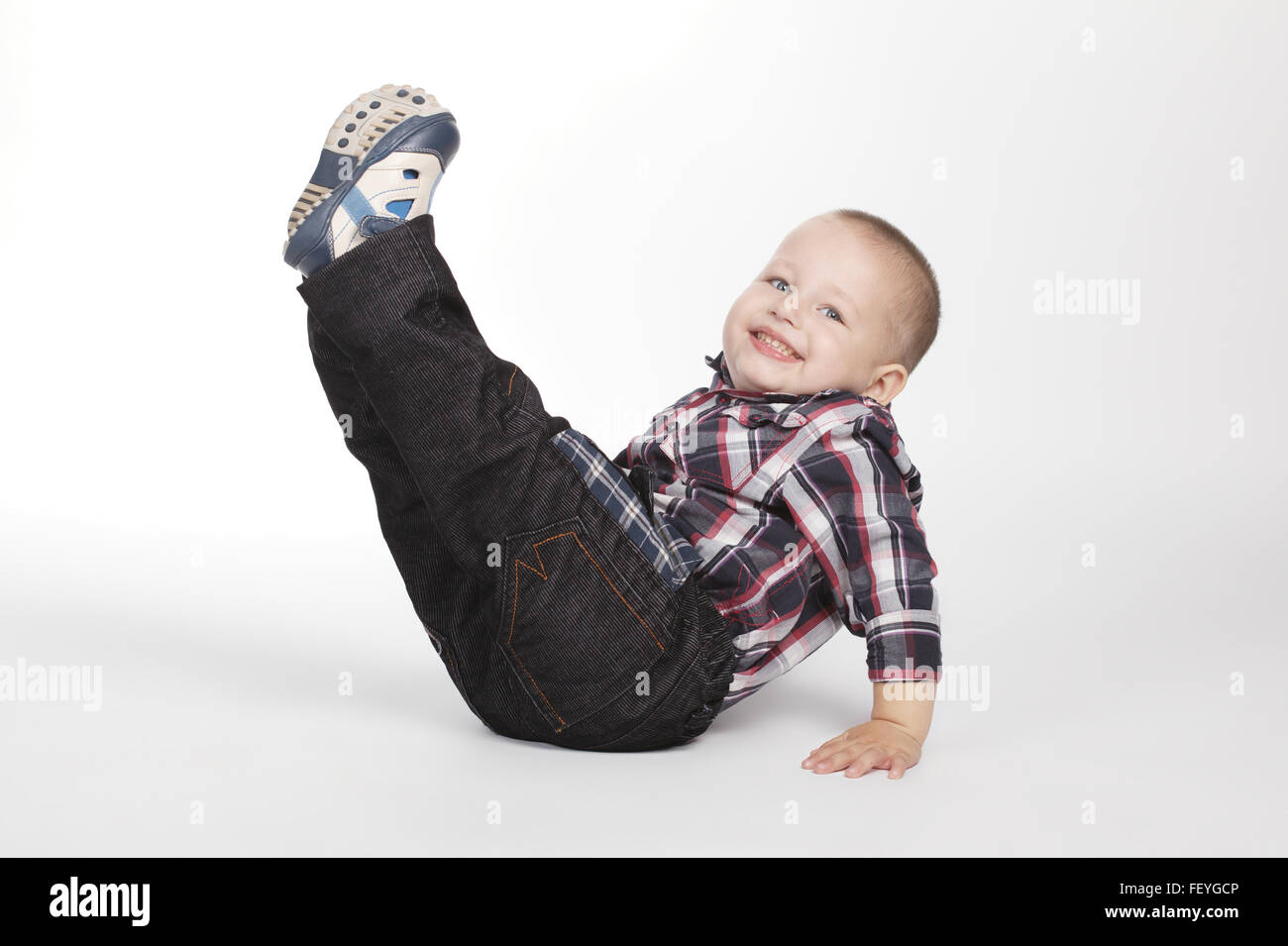 little boy with legs up Stock Photo - Alamy