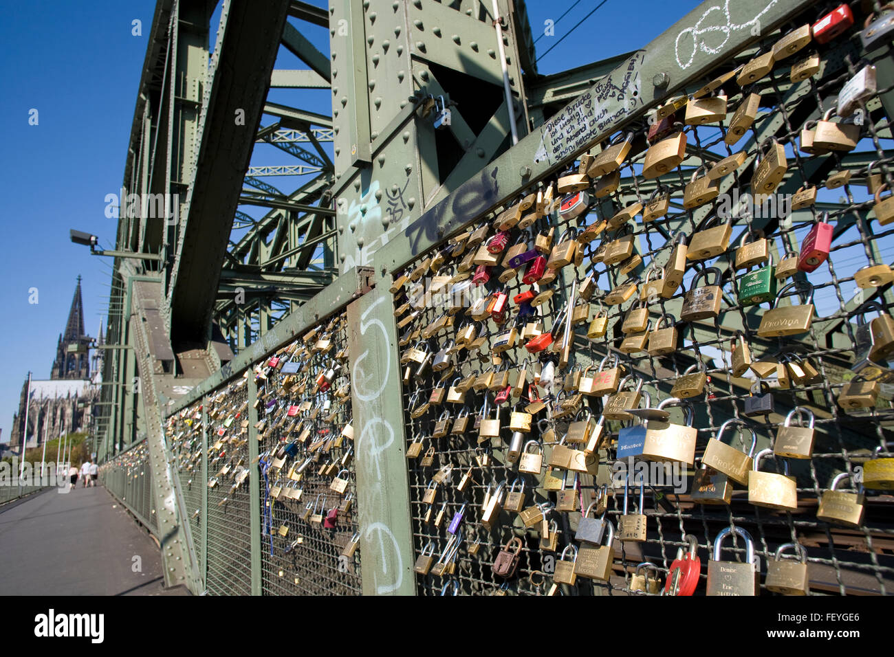 Europe, Germany, Cologne, padlocks on fence of footpath of the ...