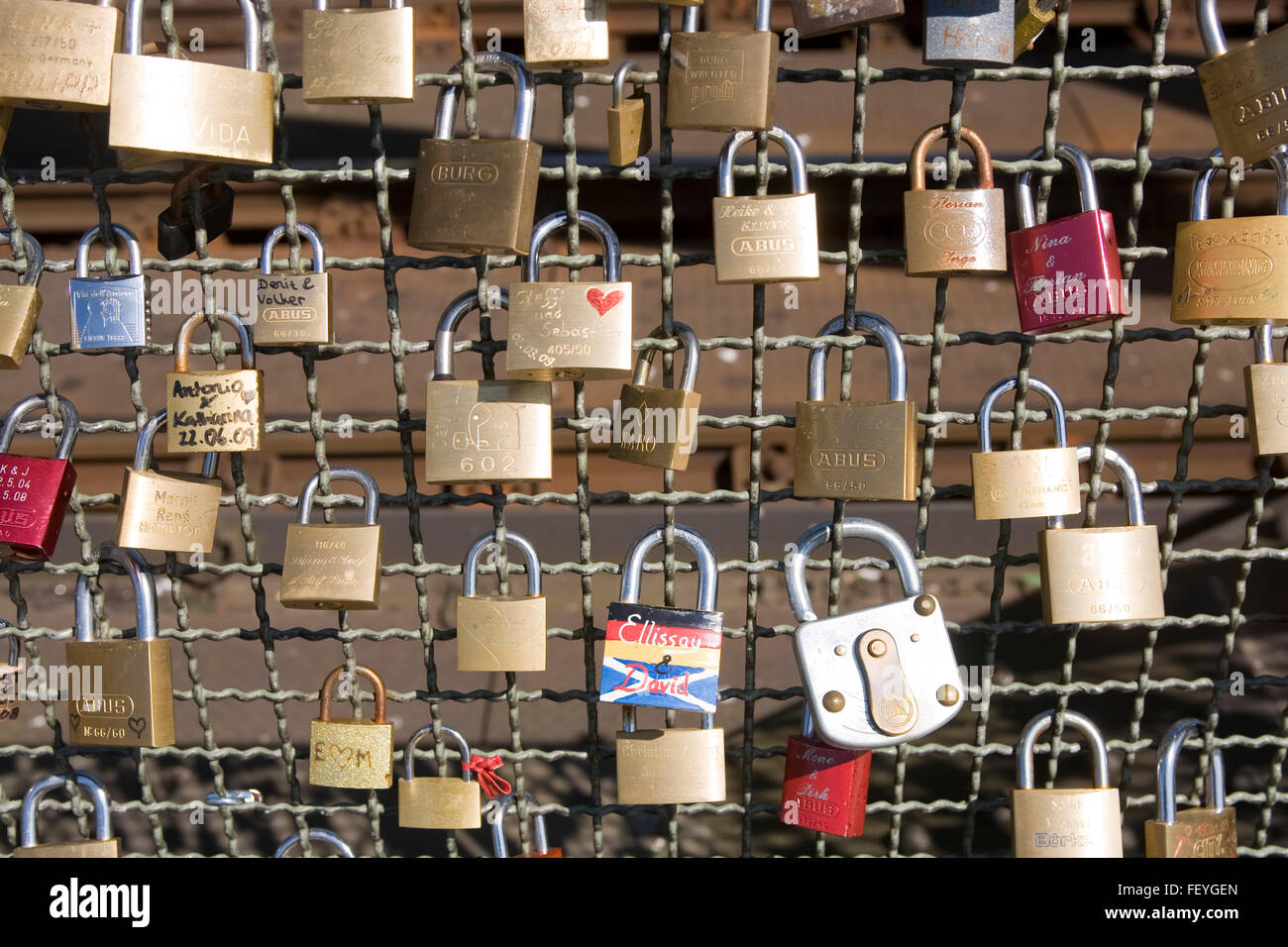 Europe, Germany, Cologne, padlocks on fence of footpath of the ...