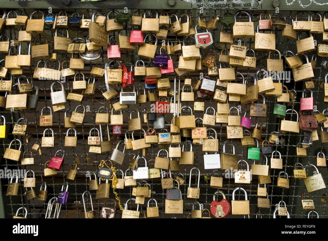 Europe, Germany, Cologne, padlocks on fence of footpath of the ...