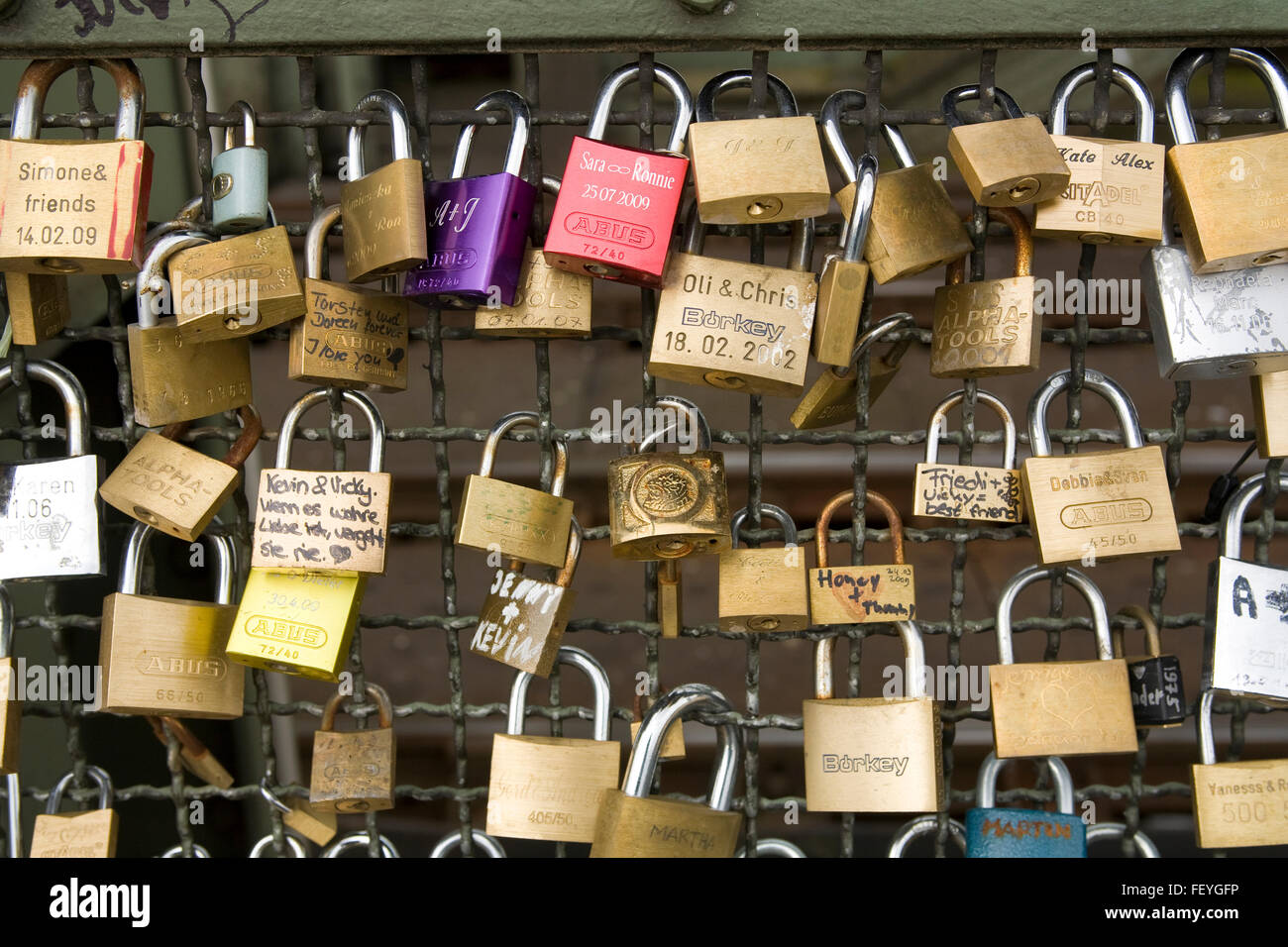 Europe, Germany, Cologne, padlocks on fence of footpath of the ...