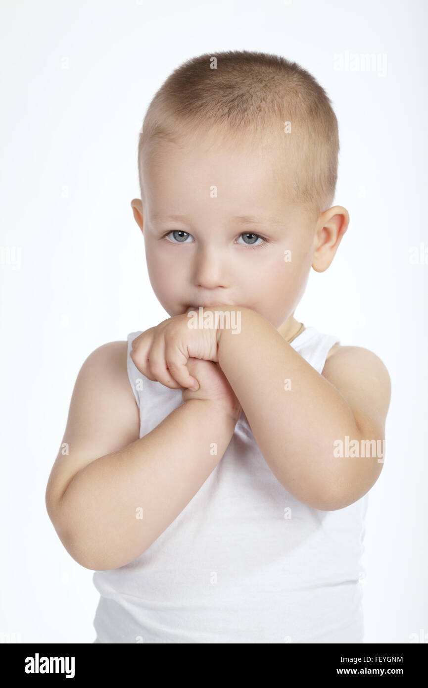 little shy boy on white background Stock Photo - Alamy