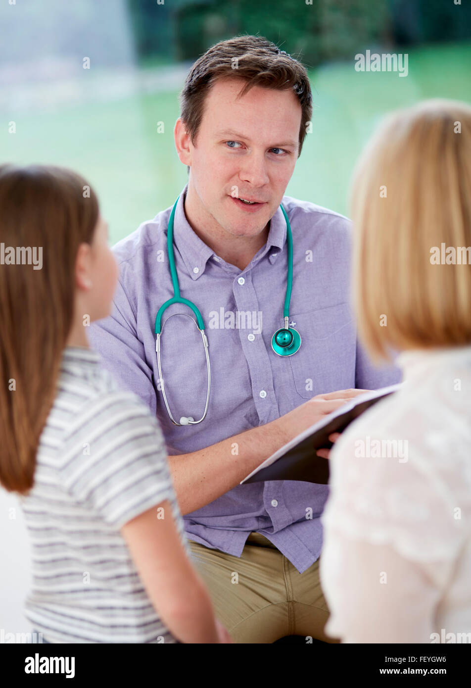 Doctor talking to patient Stock Photo - Alamy