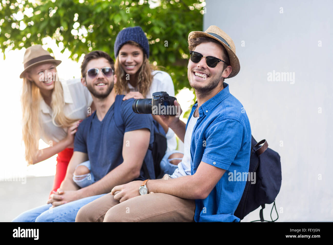 Woman taking pictures of friends hi-res stock photography and images ...