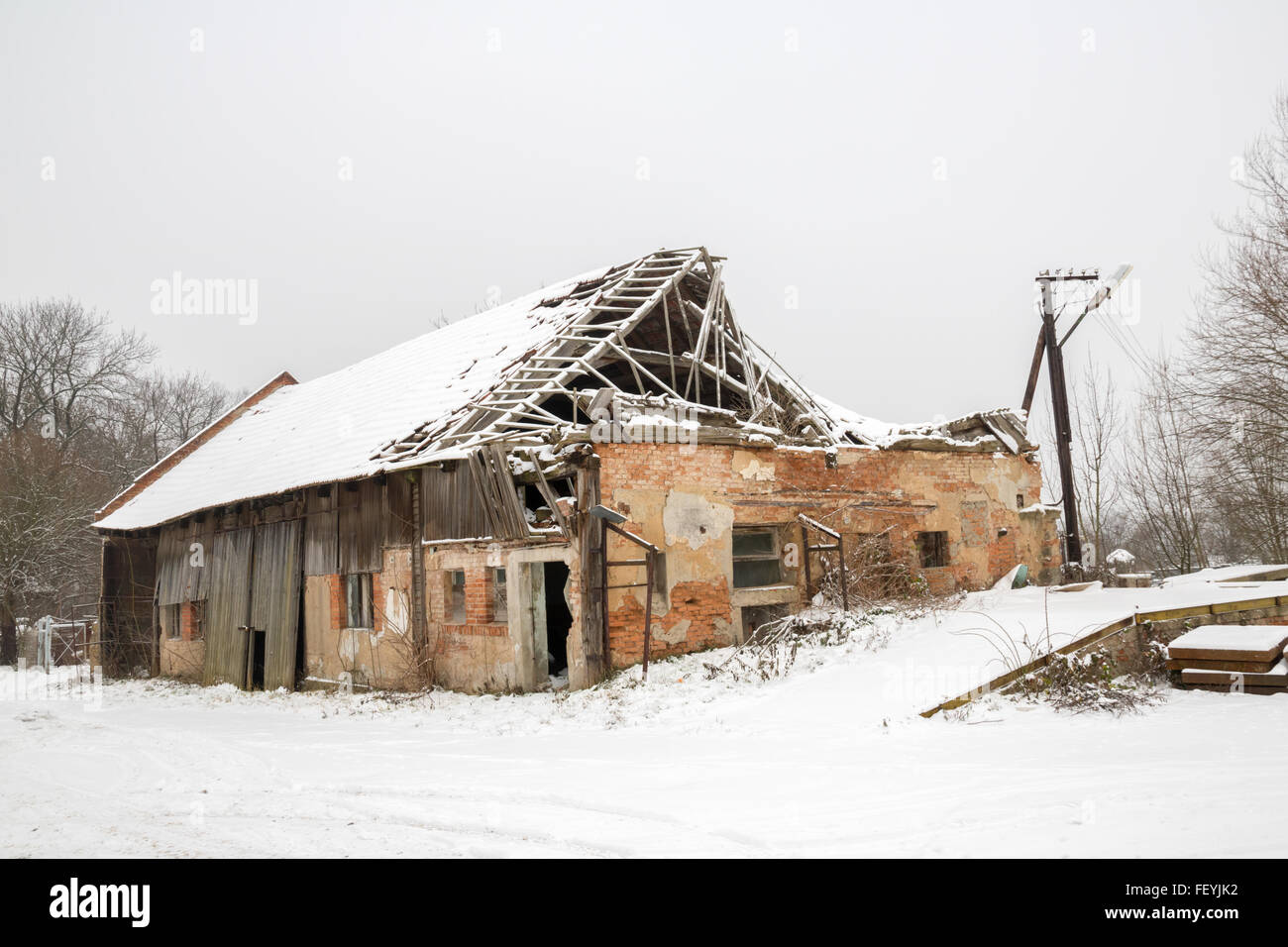 Ruined brick/wooden house, destroyed roof, in winter (snow Stock Photo ...