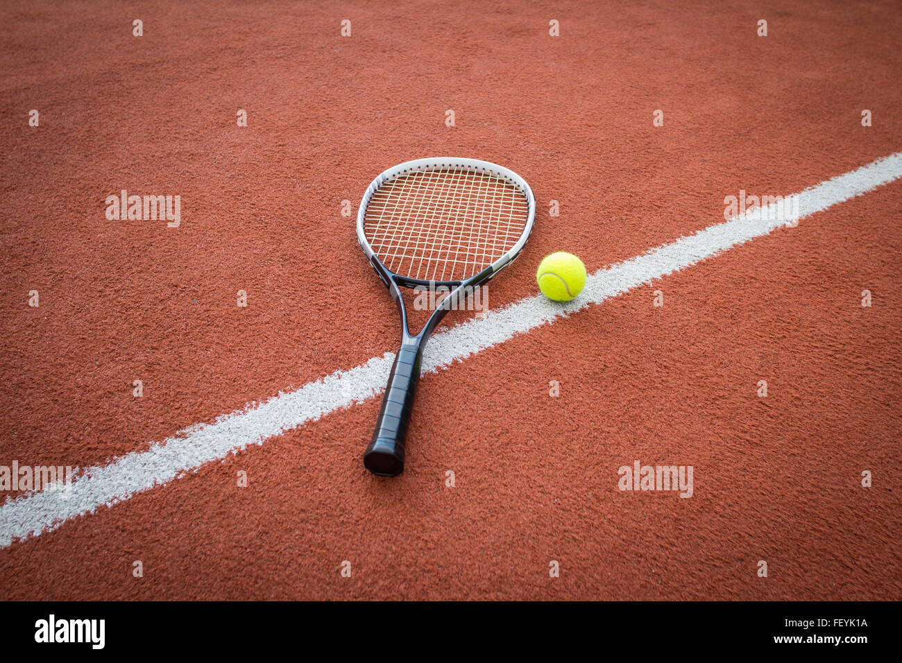 Racket and ball on a tennis court hi-res stock photography and images ...