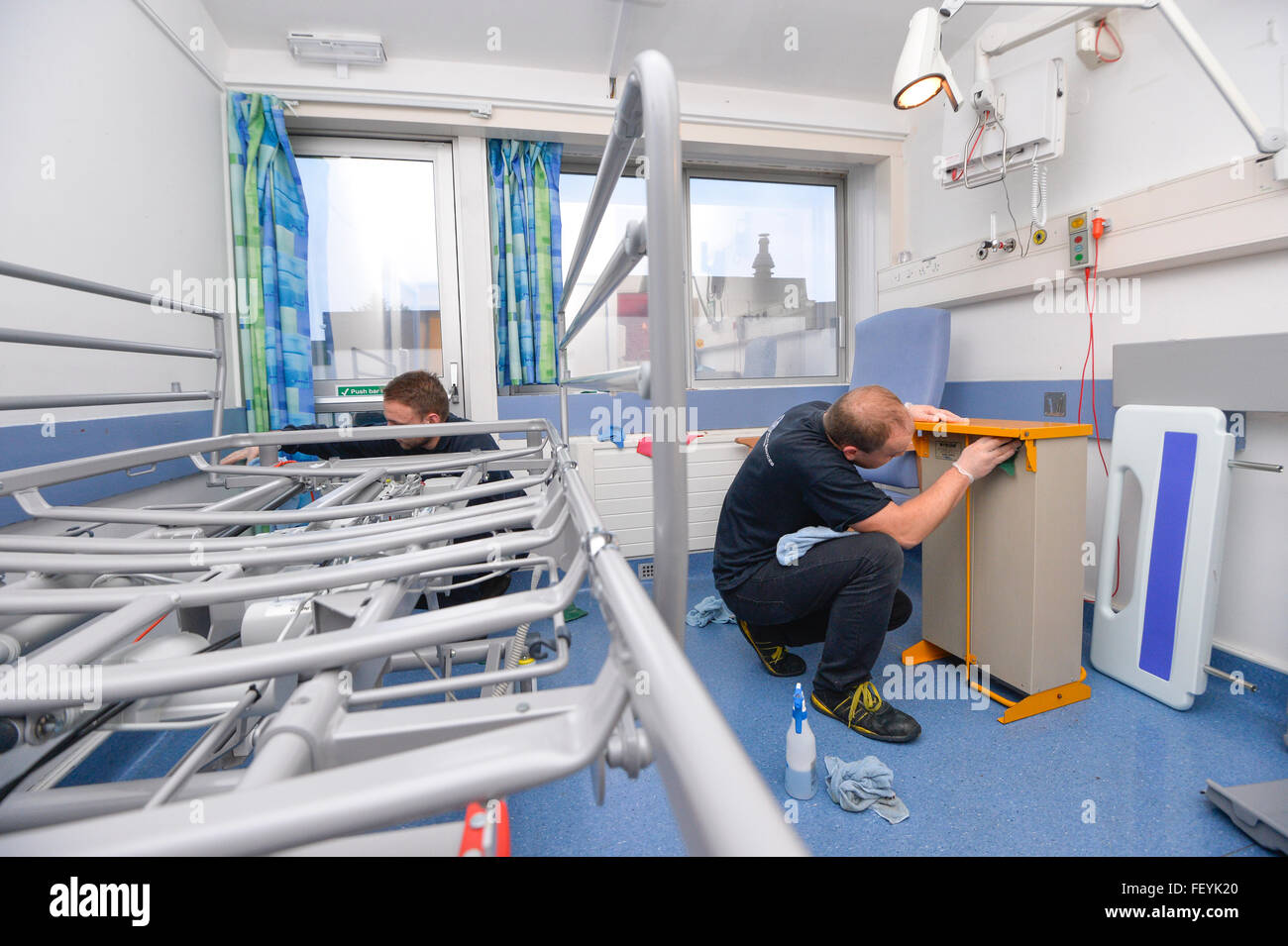 A professional cleaning team scrub, spray and wipe all surfaces in ...