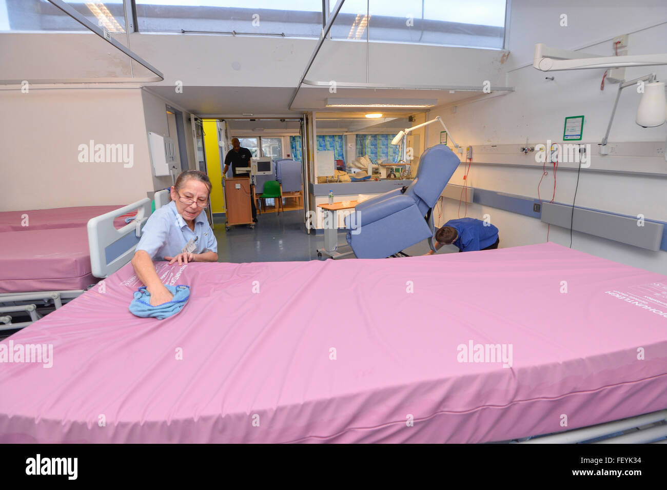 A professional cleaning team scrub, spray and wipe all surfaces in ...