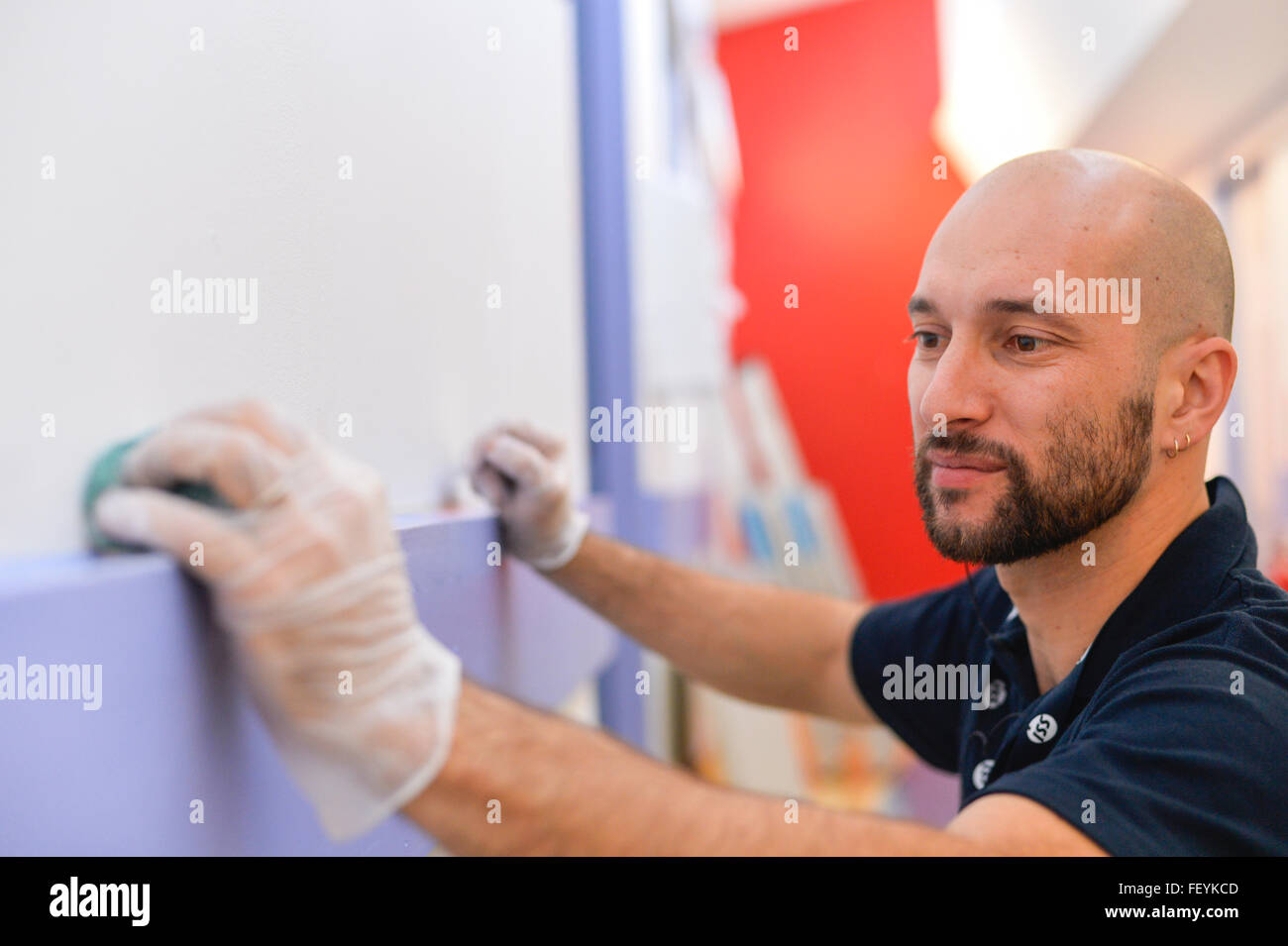 A professional cleaning team scrub, spray and wipe all surfaces in ...