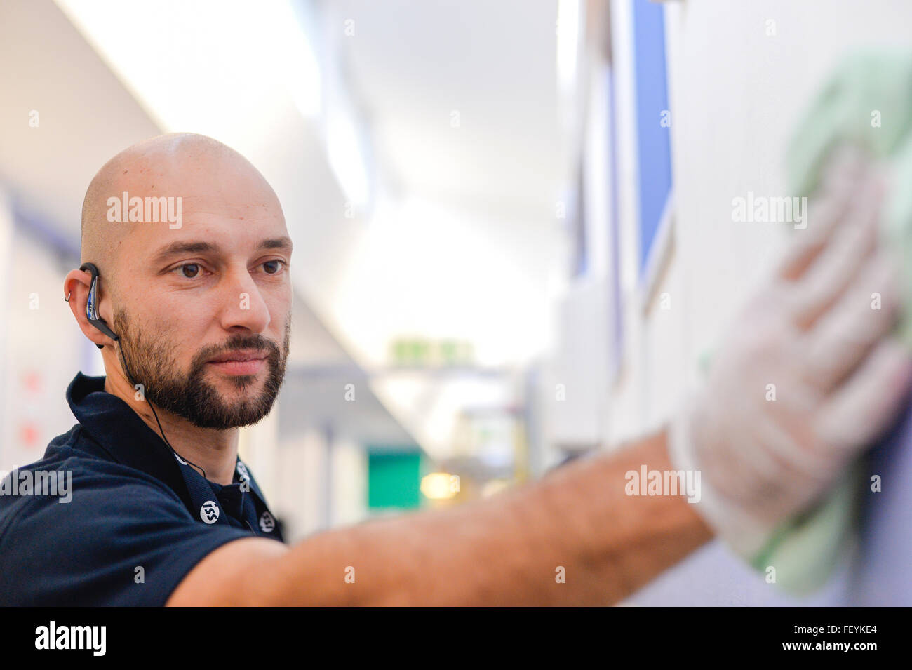 A professional cleaning team scrub, spray and wipe all surfaces in ...