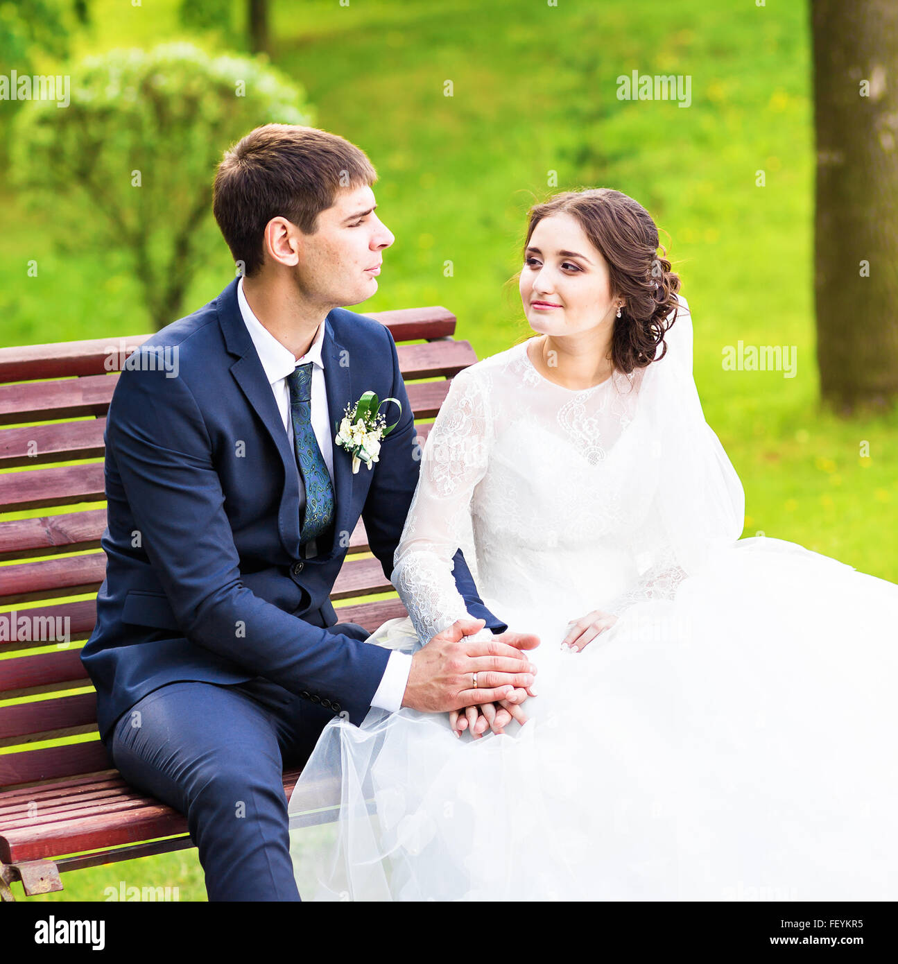 Bride and groom on the bench Stock Photo - Alamy